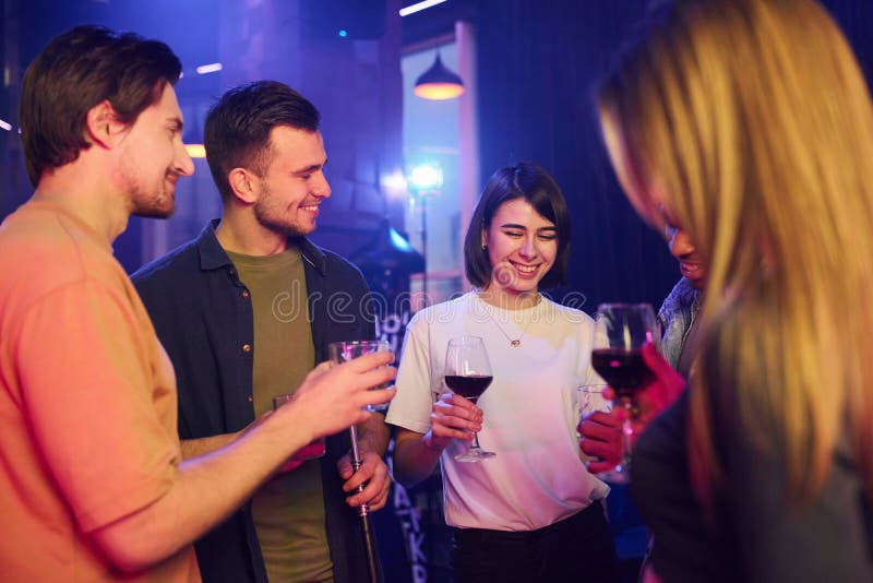 Drinking Alcohol. Group of Friends Having Fun in the Night Club ...