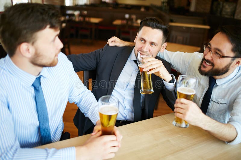 Drinking beer stock image. Image of group, beer, elegant - 73326135