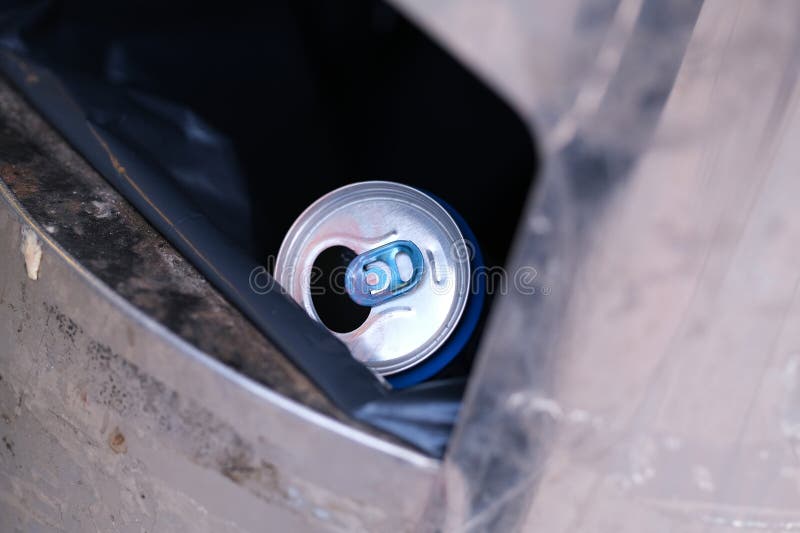A drinking can in trash stock image. Image of metal - 358034961