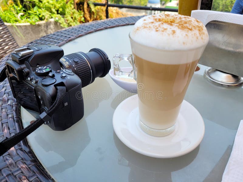 Drinking Cappuccino Coffee in the Restaurant with a Camera Ready To ...