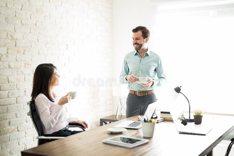 Drinking Coffee with a Coworker Stock Photo - Image of trendy, break ...