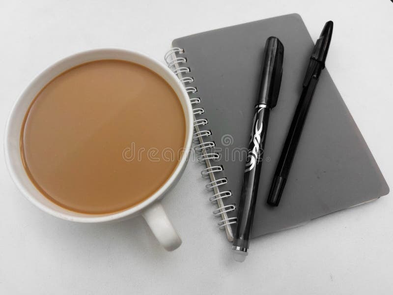 Drinking Coffee while Recording Work into a Note Stock Image - Image of ...