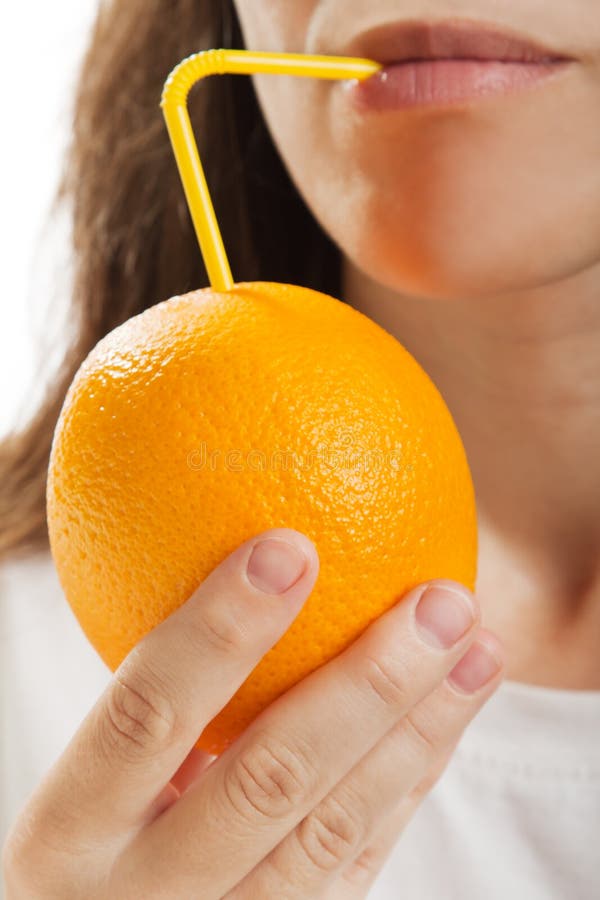 Drinking orange fruit stock photo. Image of fruit, female - 16011102