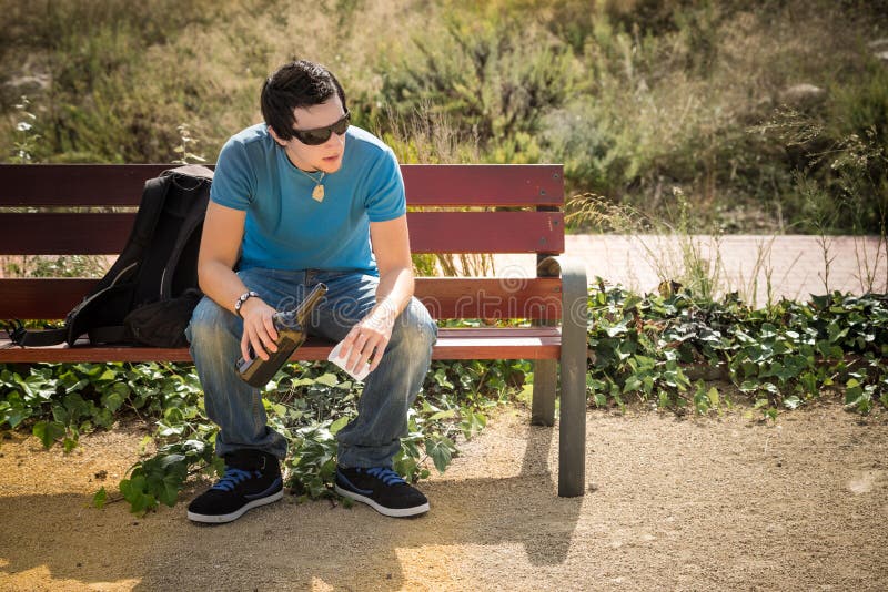 Drinking on the park bench stock image. Image of social - 34761739