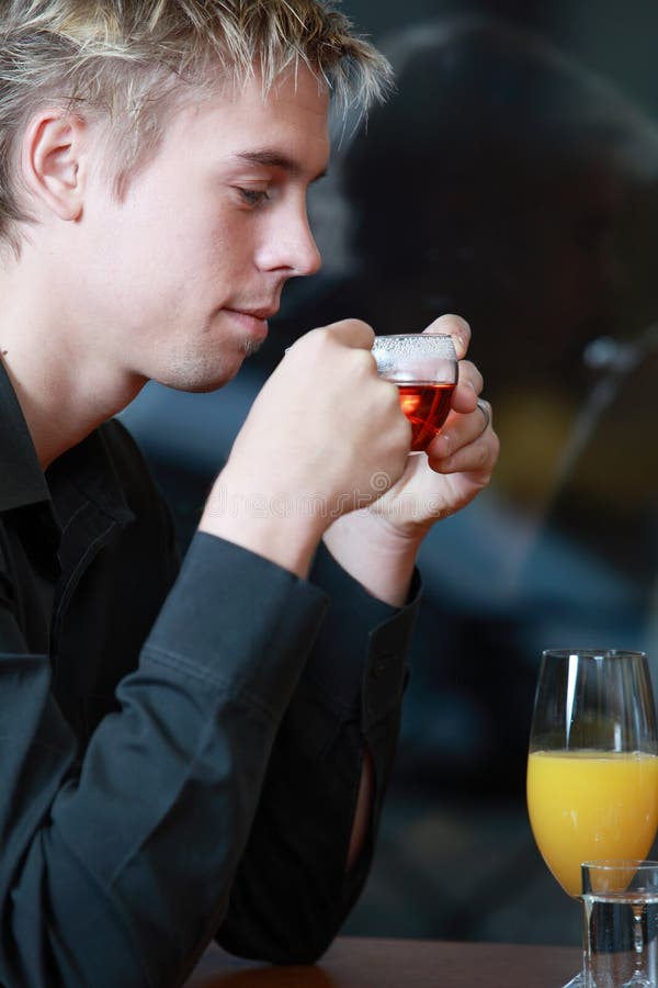 Young Woman Using Laptop in Bed Drinking Tea Stock Image - Image of ...