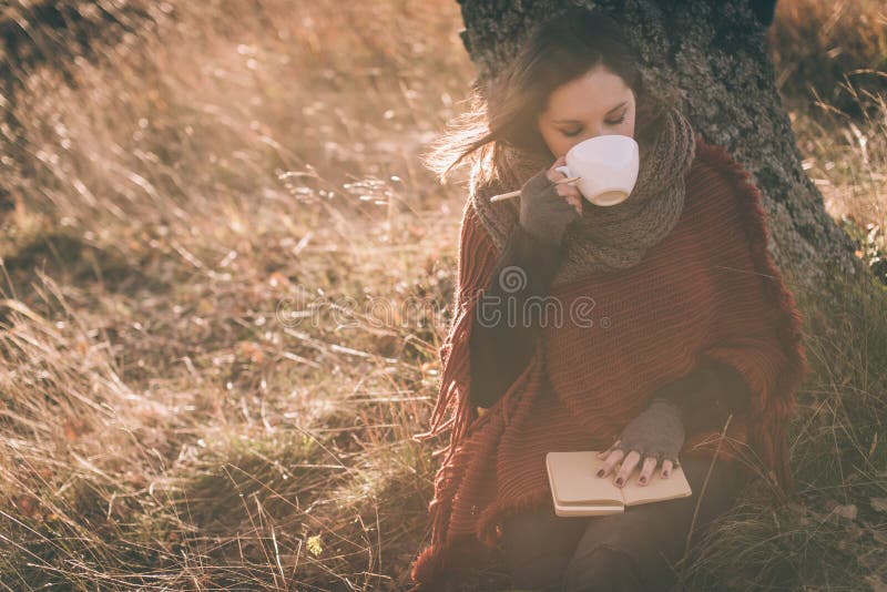 Drinking Tea or Coffee and Writing Notes Stock Photo - Image of focused ...