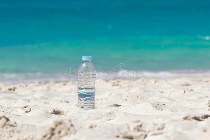 Water in bottle on beach stock photo. Image of cold, drink - 30030950