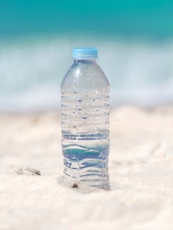 Water in bottle on beach stock photo. Image of mineral - 29710218