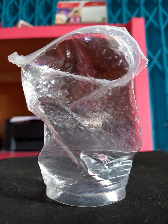 Drinking Water in an Empty Plastic Cup. Single Use Cup Stock Image ...