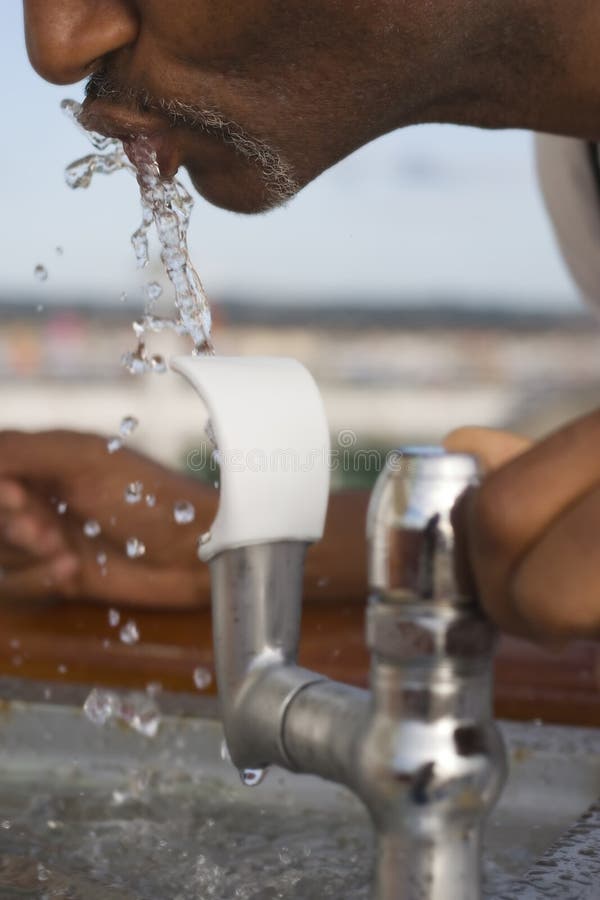 Drinking from Water Fountain Stock Photo - Image of exercise, outdoor ...