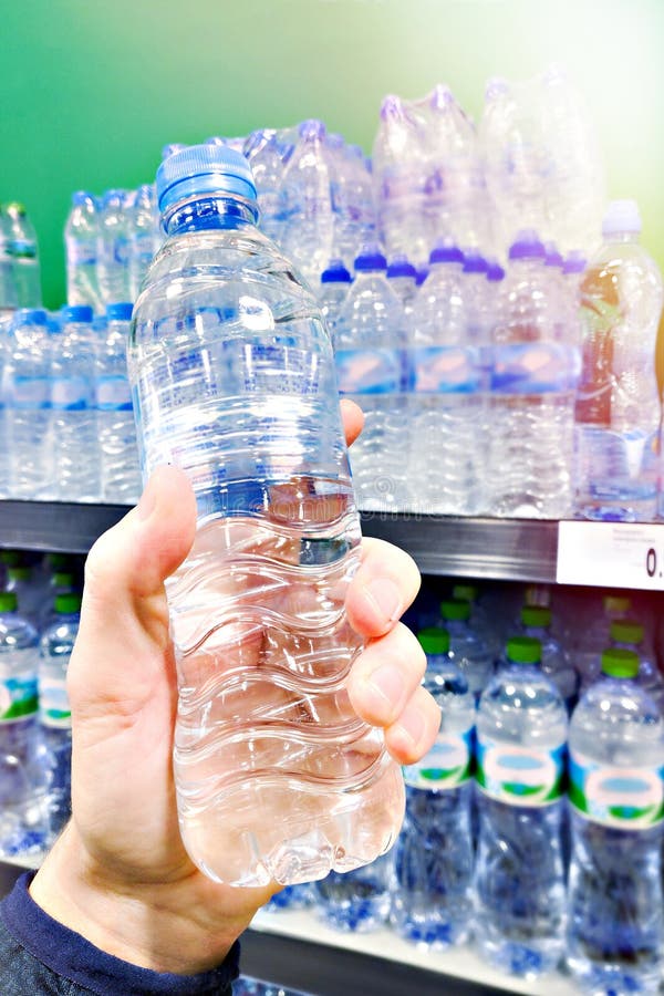 Drinking water in hand stock image. Image of grocery - 310775875