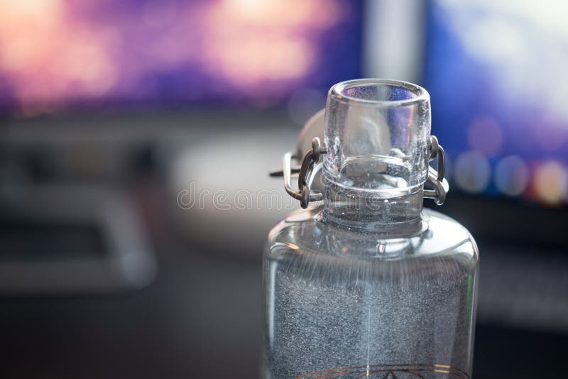 Drinking Water in the Office: Close Up of Glass Bottle, Workplace Stock ...