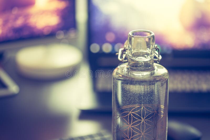 Drinking Water in the Office: Close Up of Glass Bottle, Workplace Stock ...