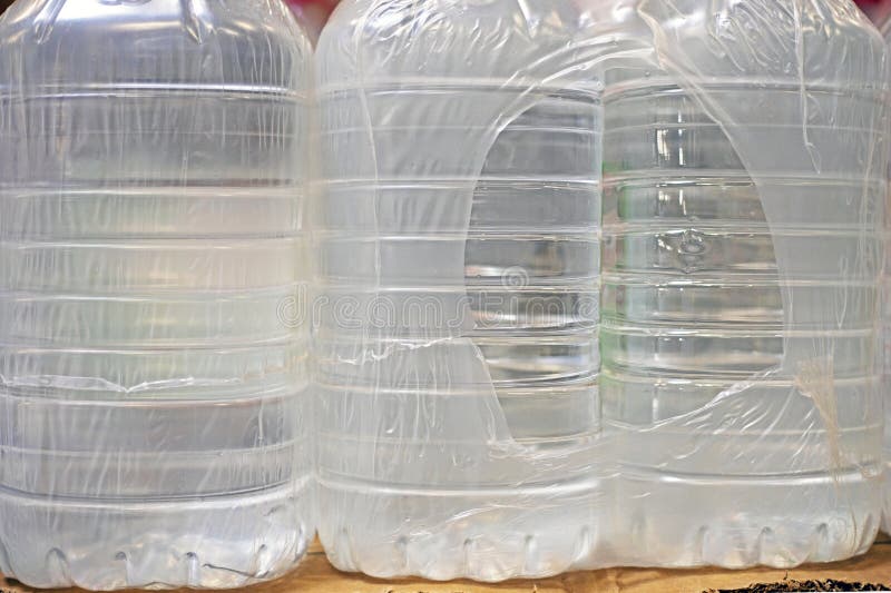 Drinking Water Packaged in Plastic Containers on the Shelves Stock ...