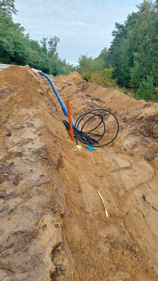 Drinking Water Pipeline Under Construction in Deep Ditch Stock Photo ...