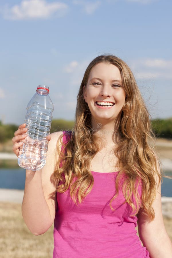Drinking water in summer stock photo. Image of beach - 41942136