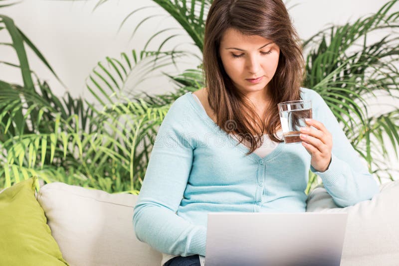 Drinking Water and Using Laptop Stock Photo - Image of water, computer ...
