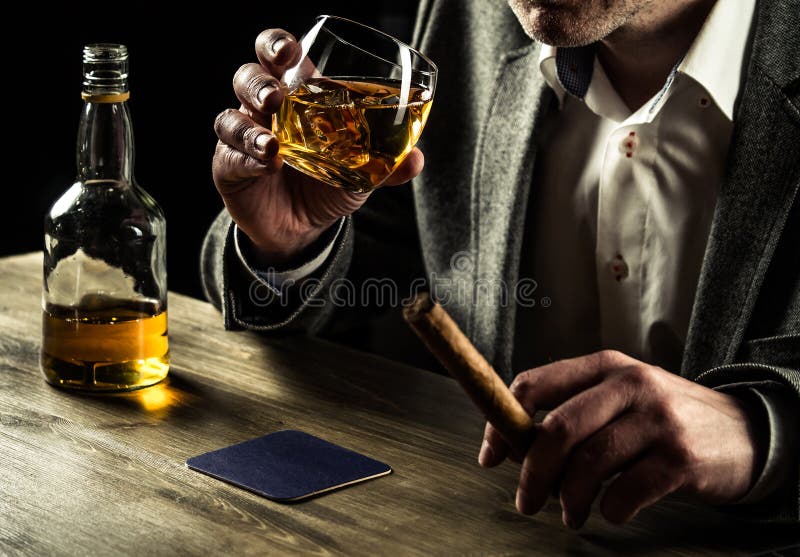 Drinking whiskey at night stock photo. Image of drink - 69652068