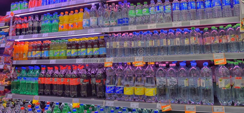 Drinks in Plastic Bottles on Store Shelves Editorial Photo - Image of ...