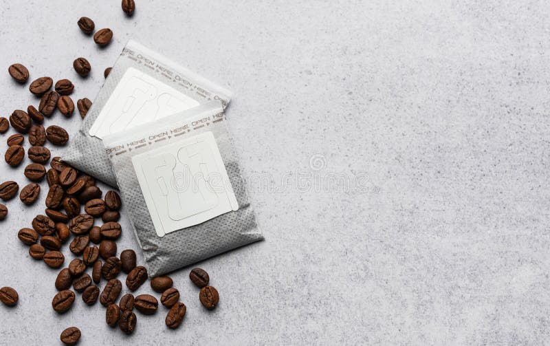 Drip Coffee Paper Bags with Coffee Beans Stock Photo - Image of white ...