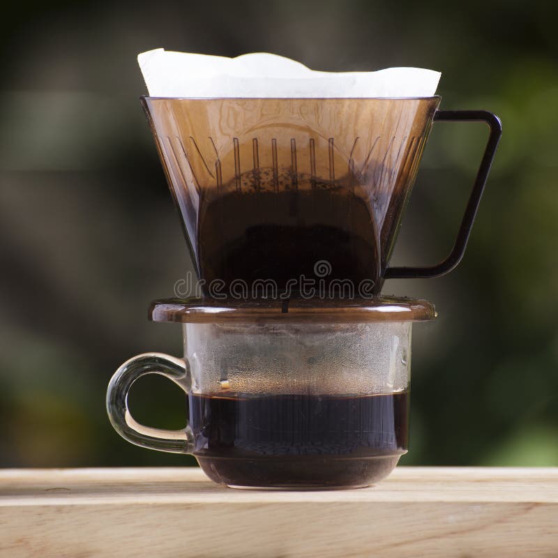 Cup of Dripping Fresh Hot Coffee on the Paper Filter in Cafe Stock ...