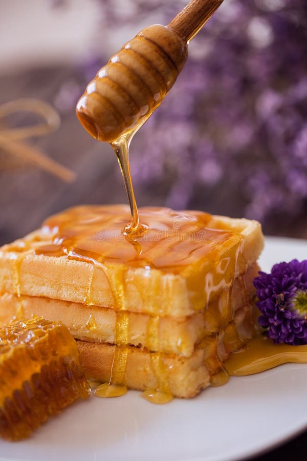 Dripping Honey from a Wooden Dipper on Waffle Stock Photo - Image of ...