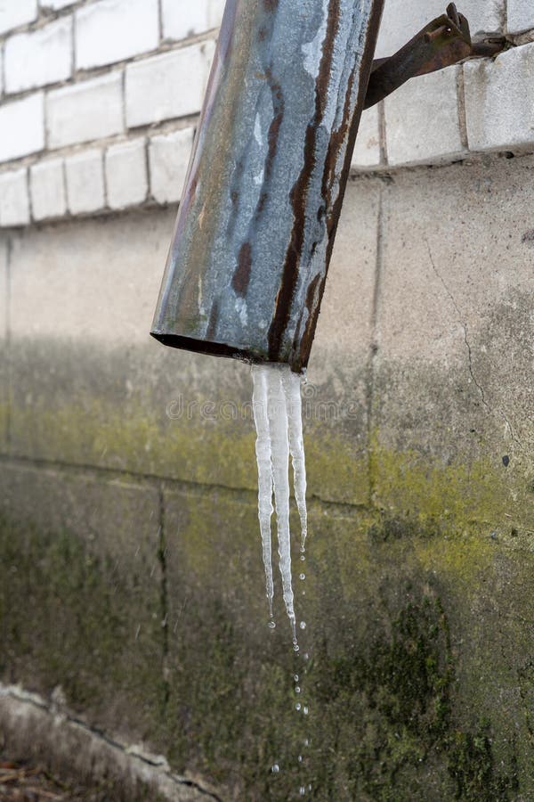 Dripping Icicle on Gutter Metal Pipe Stock Image - Image of steel ...