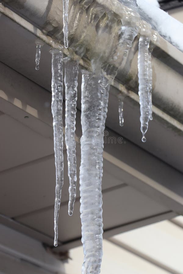 Dripping Icicles on White House Eave Stock Photo - Image of white, light: 352919726