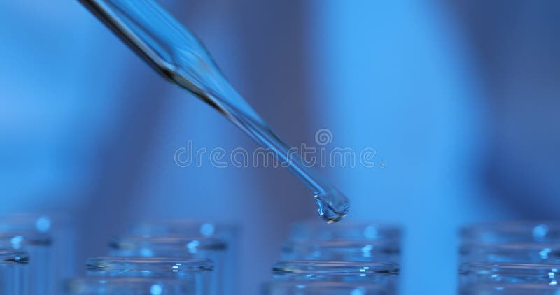 Dripping Liquid into Glass Test Tubes during a Laboratory Experiment ...