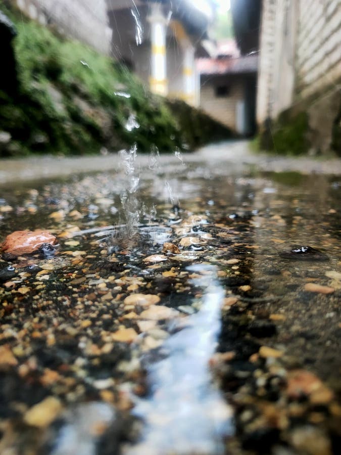 Dripping rainwater stock photo. Image of ground, dripping - 261746188