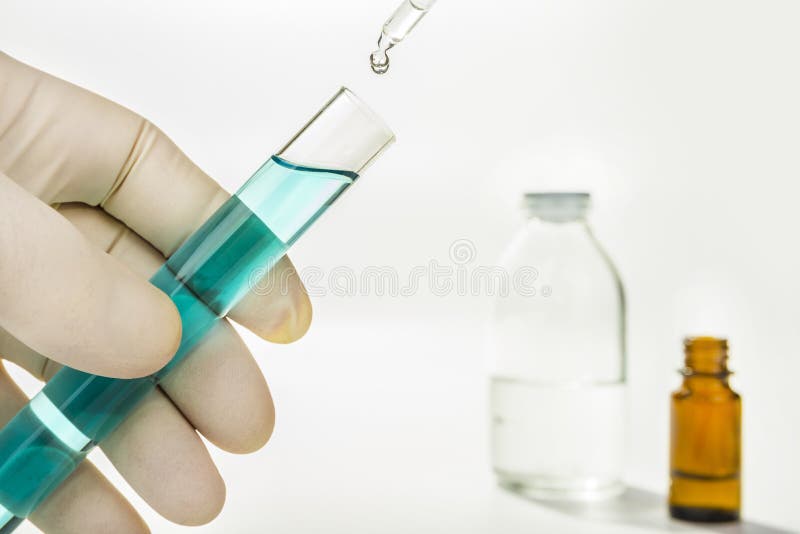 Dripping Reagent into Test Tube with Liquid Sample Stock Photo - Image ...