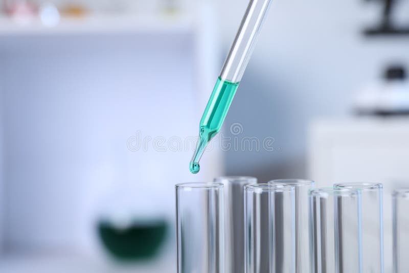 Dripping Sample into Test Tube in Chemistry Laboratory Stock Photo ...