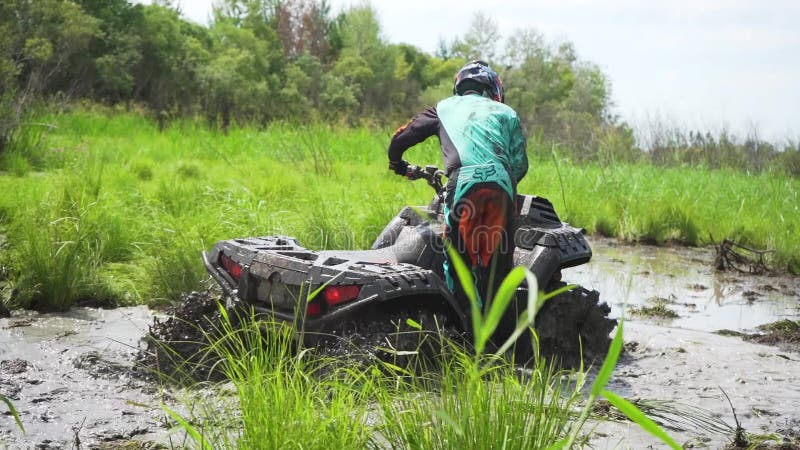 Drive ATV through Swamp, Water, Mud and Mud. Slow Motion Stock Footage ...