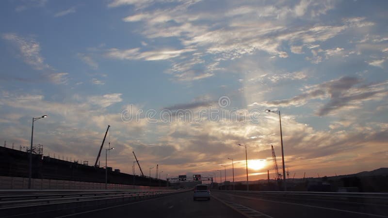 Drive through the Brige Under Construction with Dramatic Clouds and the ...