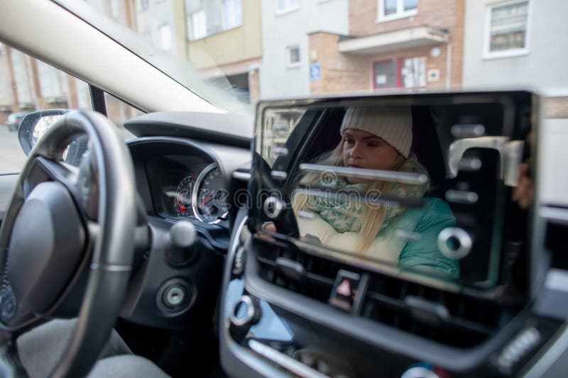 A Driver Actively Engaged with the Navigation Dashboard within Their ...