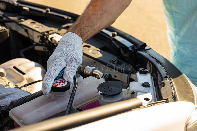 Driver Check the Coolant Level in the Engine Compartment of the Car ...