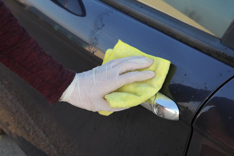 Driver Cleaning Steering Wheel of Car Using Antibacterial Solution and ...
