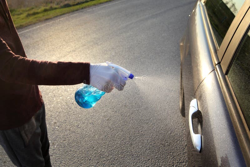 Driver Cleaning Steering Wheel of Car Using Antibacterial Solution and ...
