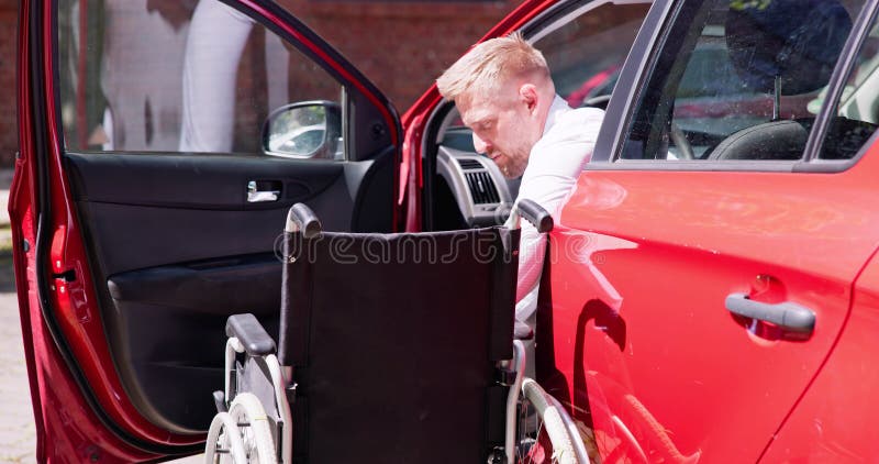 Driver with a Disability Sitting in the Car with Wheelchair Inside ...