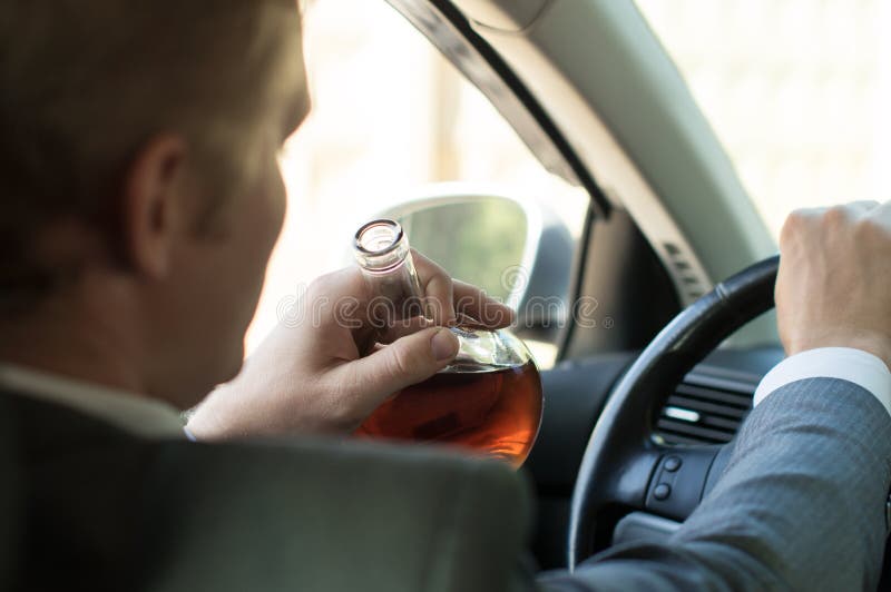 Driver Drinks Alcohol Driving a Car Stock Photo - Image of dangerous ...