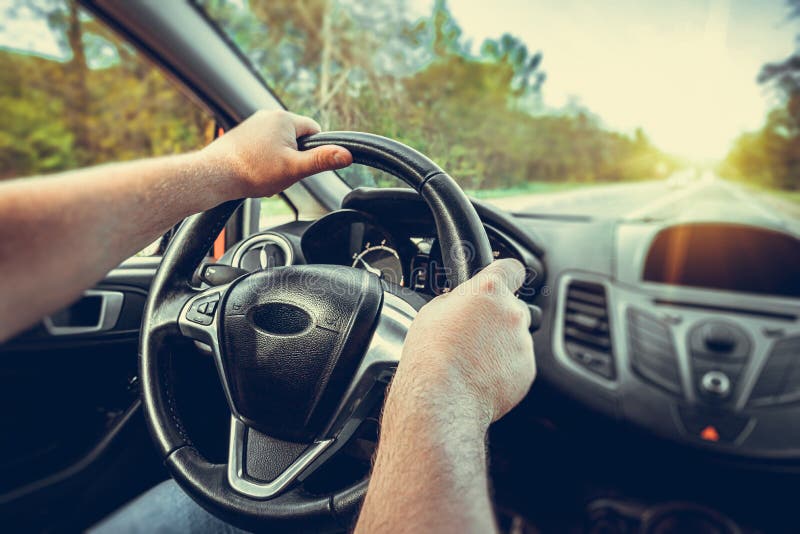 The Driver is Driving the Car on the Highway. View from the Cockpit ...