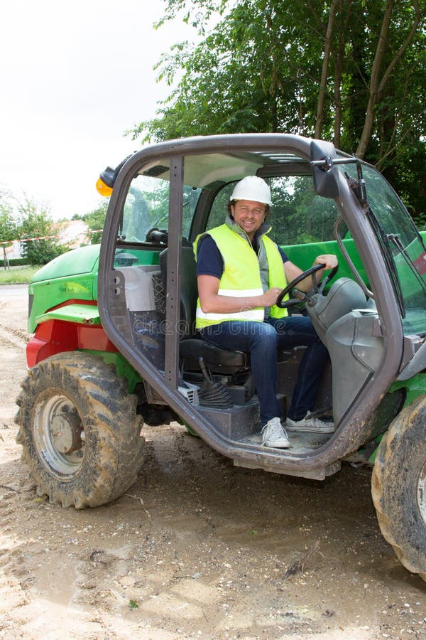 Driver Excavator Digging and Moving Earth in Construction Site Stock ...