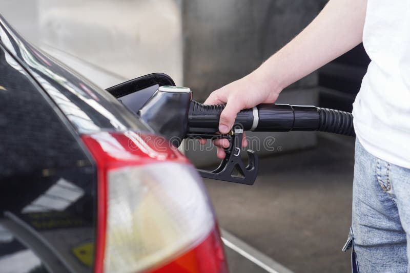 A Driver Fills a Car with Fuel at a Gas Station Stock Image - Image of ...