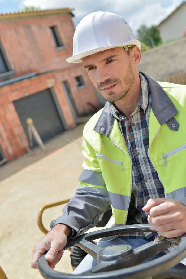 Driver in Front Construction Machinery on Building Site Stock Photo ...