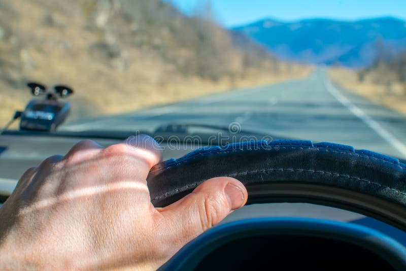 Driver Hand on the Steering Wheel Inside the Car Stock Image - Image of ...