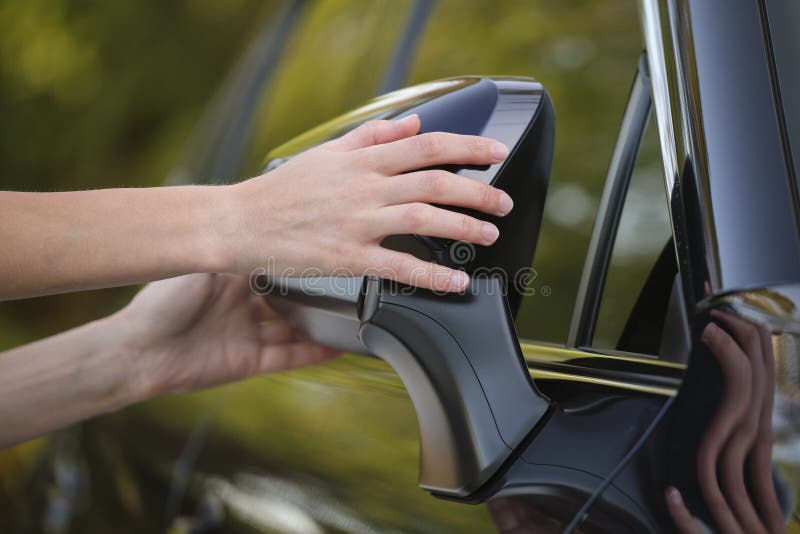 Driver Hands Adjusting Side View Mirror of a Car Stock Photo - Image of ...