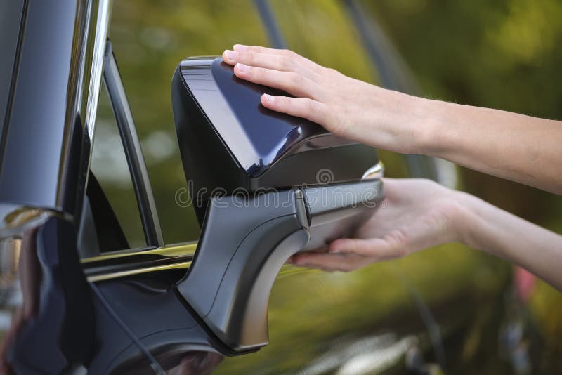Driver Hands Adjusting Side View Mirror of a Car Stock Photo - Image of ...