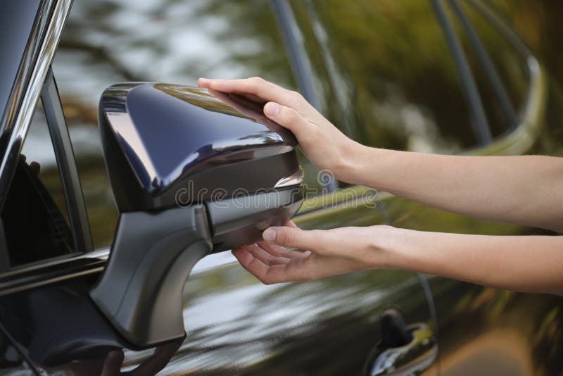 Driver Hands Adjusting Side View Mirror of a Car Stock Photo - Image of ...