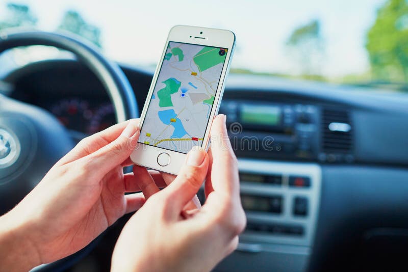 Driver Hands Holding a Phone with Navigator on a Screen Stock Image ...
