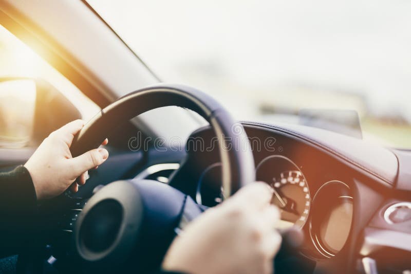 Driver Hands on Steering Wheel Driving a Car Stock Image - Image of ...